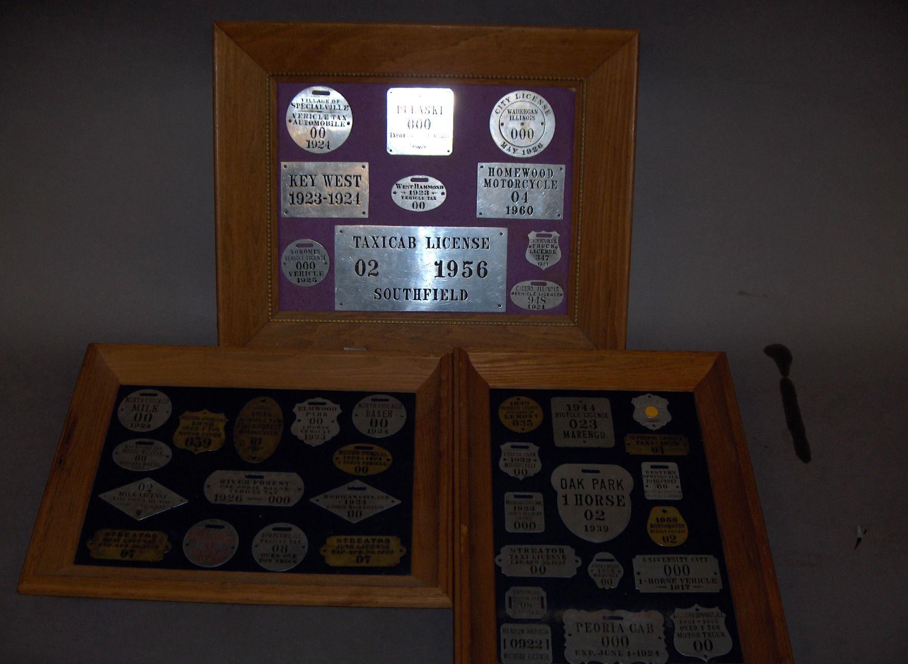 Bonhams Cars : A collection of assorted vehicle tax and license plates,