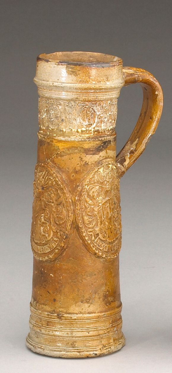 Bonhams : A German stoneware flagon and two German pewter relief plaques