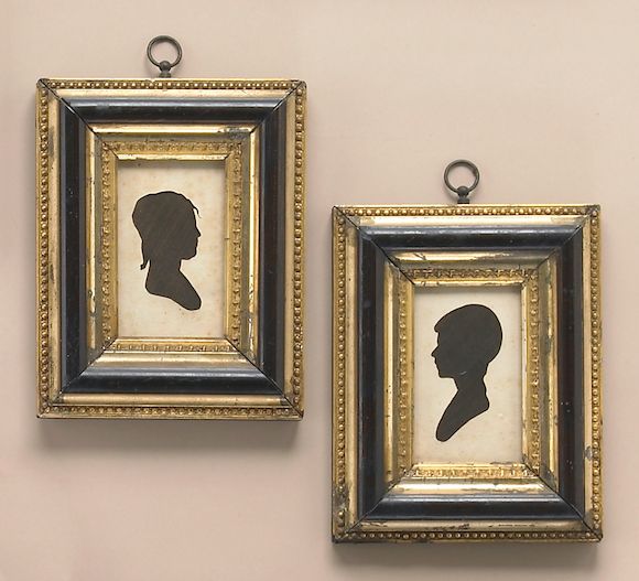 Bonhams : A pair of hollow cut silhouettes of a young boy and girl