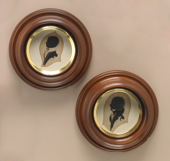 Bonhams : A pair of painted hollow cut silhouettes of young gentlemen