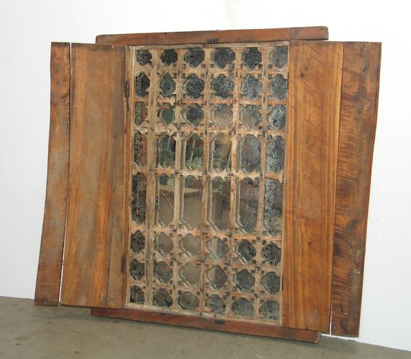 Bonhams : A Moroccan window screen with later mirror