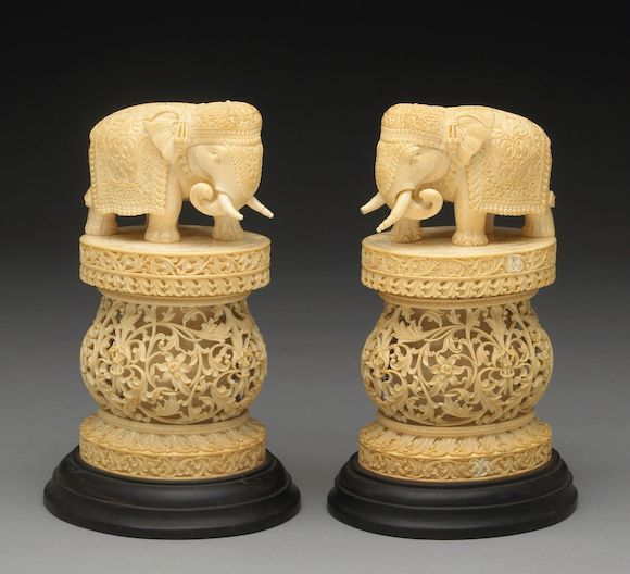Bonhams : A pair of Indian carved ivory elephants on pedestals