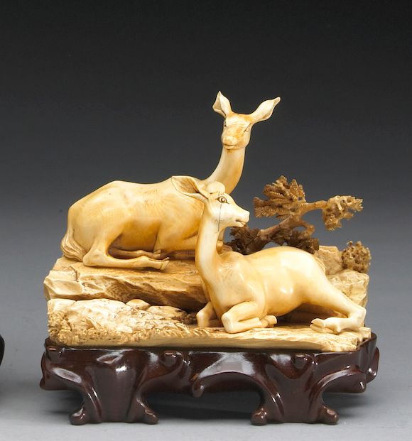 Bonhams : A tinted and carved ivory figural group of deer