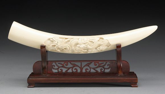 Bonhams : An ivory tusk section with dragon decoration