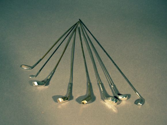 Bonhams : A collection of silver hat pins in the form of golf clubs,