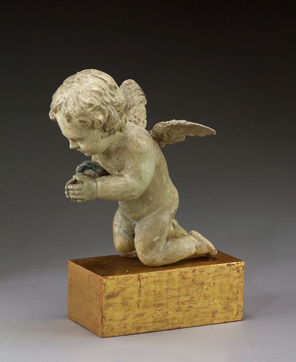 Bonhams : An Italian carved and polychrome figure of a putto