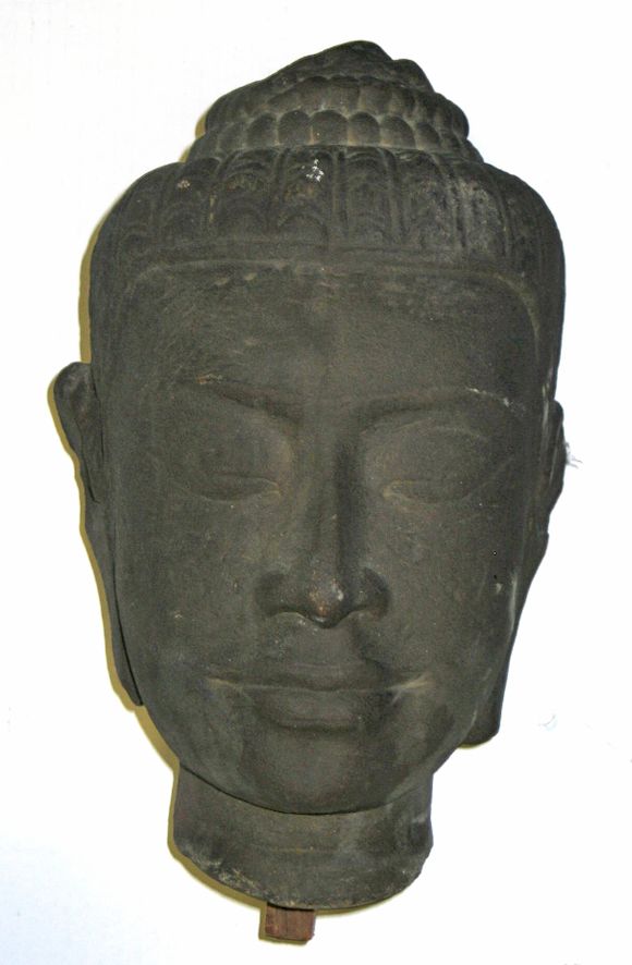 Bonhams : A Khmer style carved stone head of the Buddha