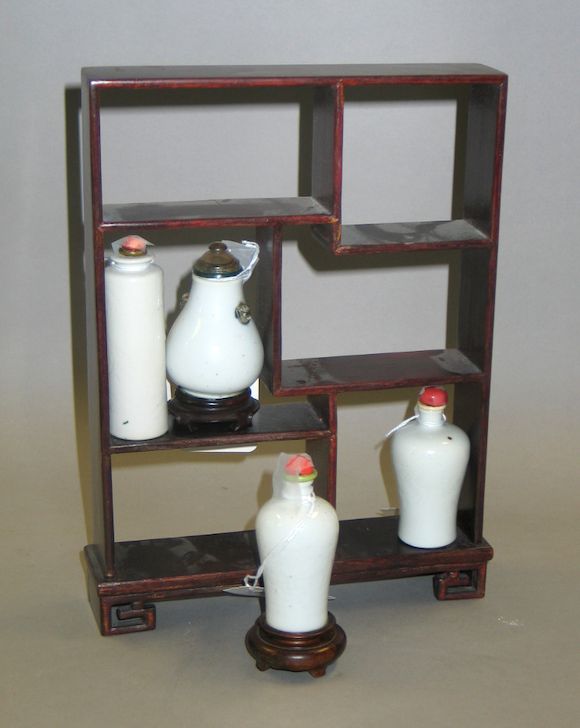 Bonhams : Four white glazed porcelain snuff bottles together with a ...