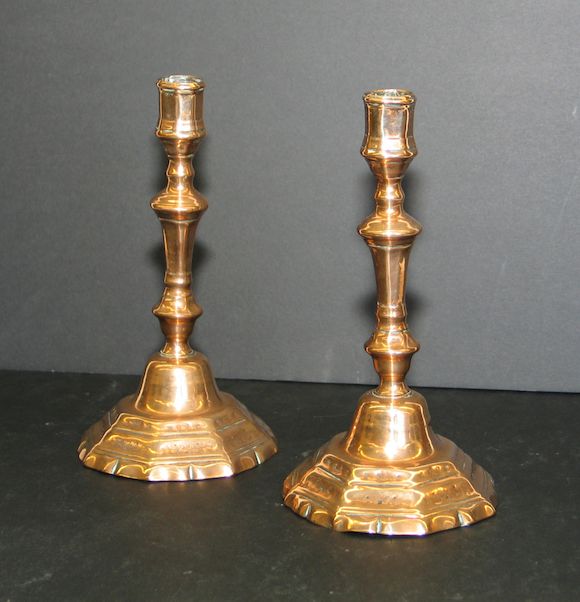 Bonhams : A pair of Louis XV bell metal candlesticks
