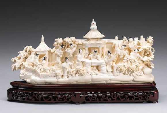 Bonhams : A carved ivory scene of beauties in a garden