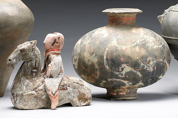 Bonhams : Two painted gray pottery burial wares Han Dynasty