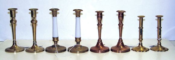Bonhams : Four pairs of English or French brass candlesticks