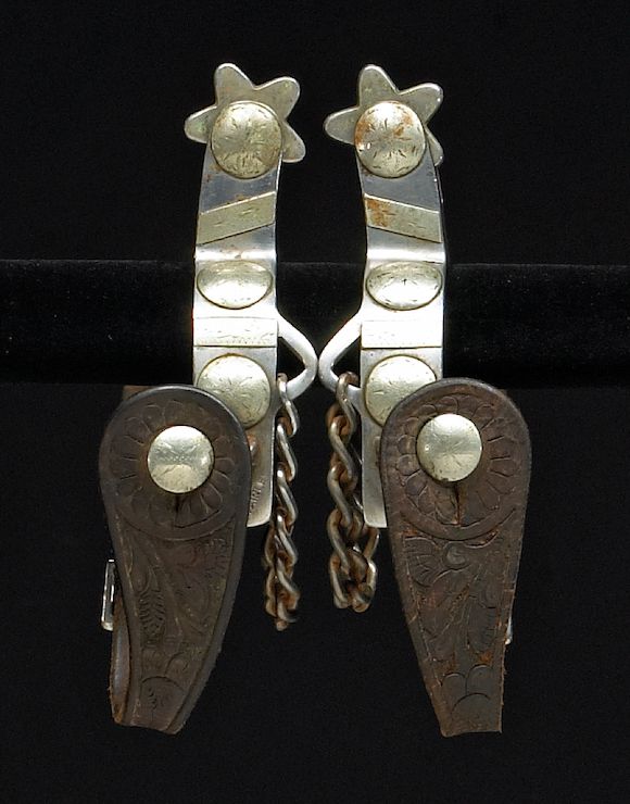 Bonhams : A pair of silver-mounted Crockett bronc spurs