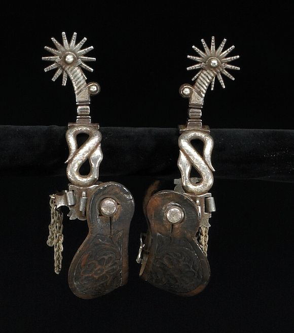 Bonhams : A pair of silver-mounted 'snake' spurs