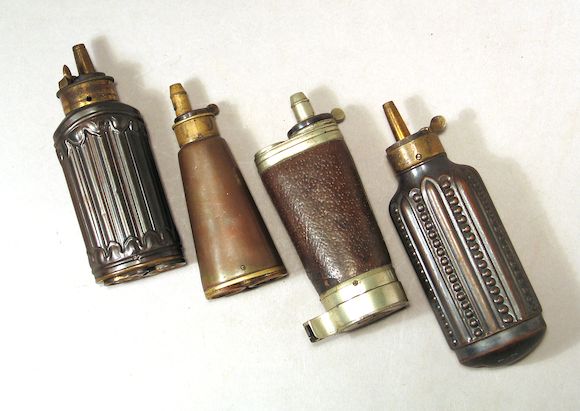 Bonhams : A lot of four 19th century pistol powder flasks