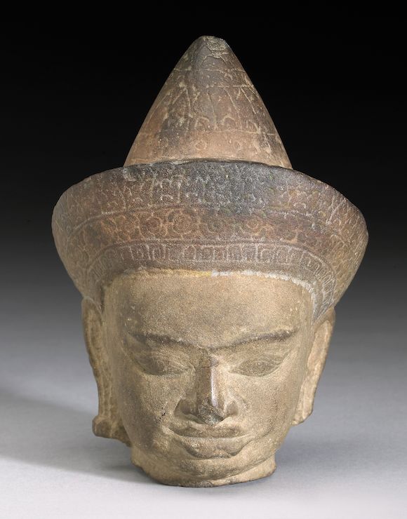 Bonhams : A carved stone male head Style of Angkor Wat, 12th Century