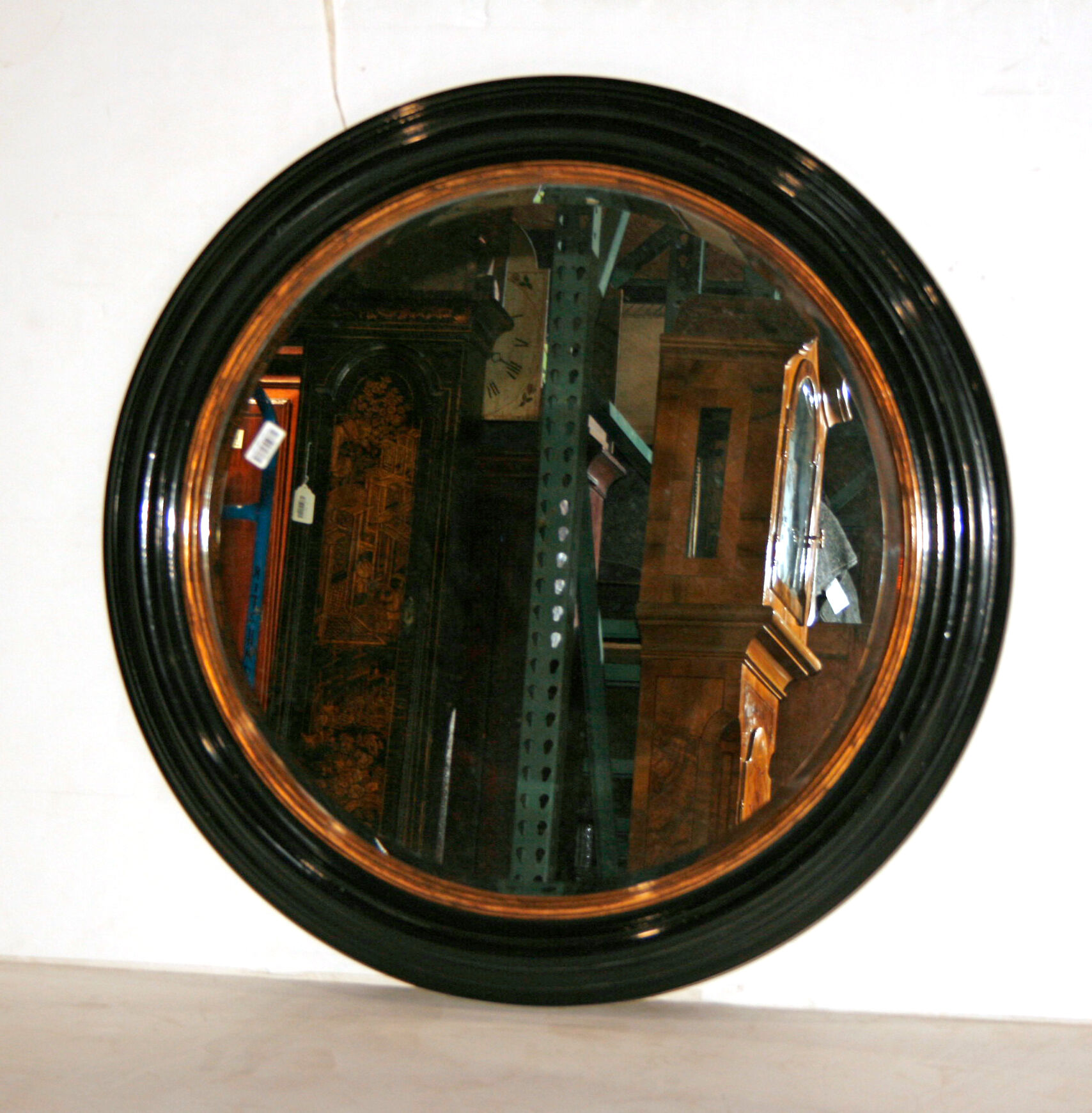 Bonhams : A Regency style parcel gilt ebonized mirror