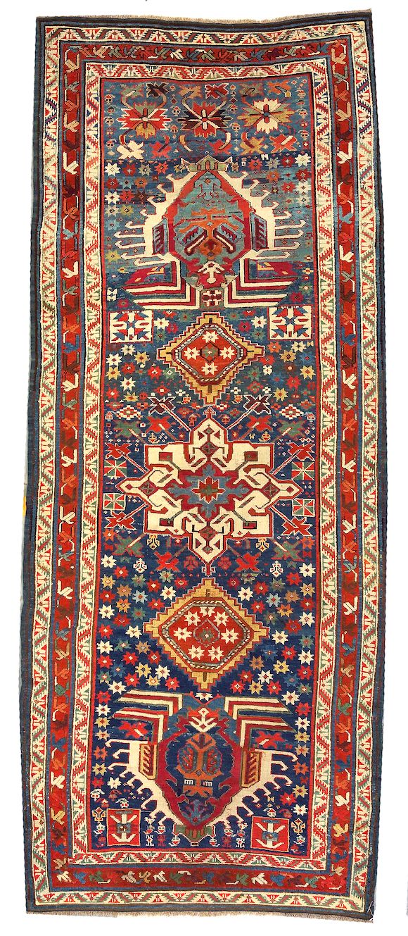 Bonhams : A Shirvan runner Caucasus, size approximately 4ft. x 9ft. 7in.