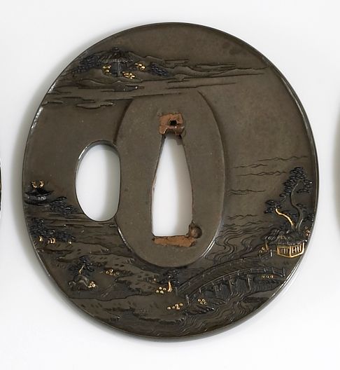 Bonhams : A shakudo tsuba with mixed metal accents 19th Century