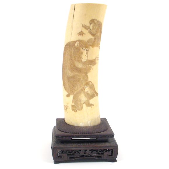 Bonhams : An Ivory tusk with carved monkey
