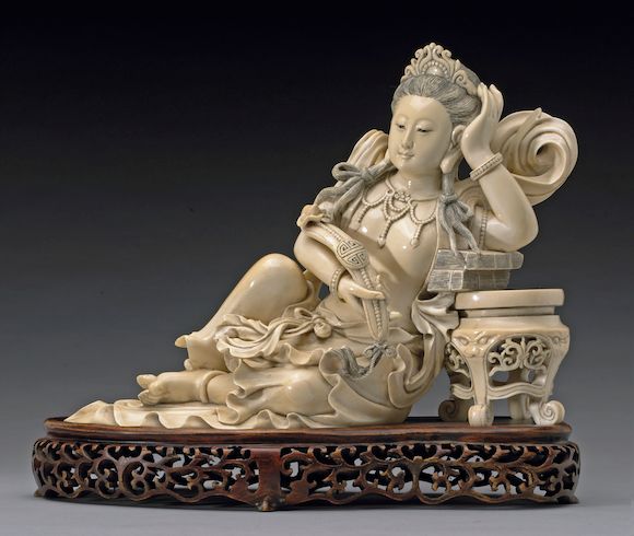 Bonhams : A carved ivory reclining Guanyin