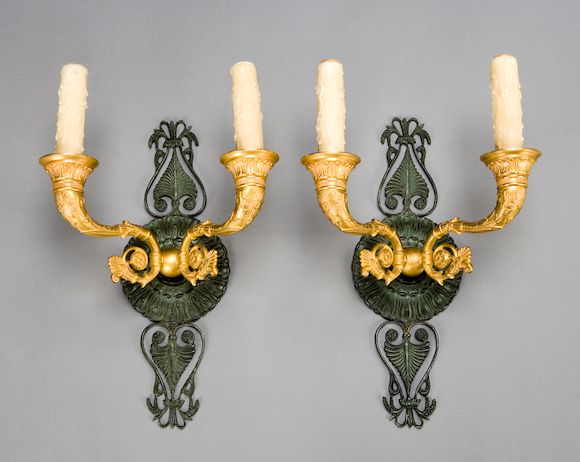 Bonhams : A pair of Empire style gilt and patinated bronze two light ...