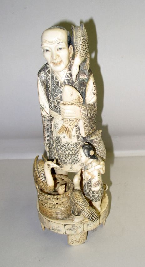 Bonhams : A Japanese style pieced ivory okimono of a cormorant fisherman