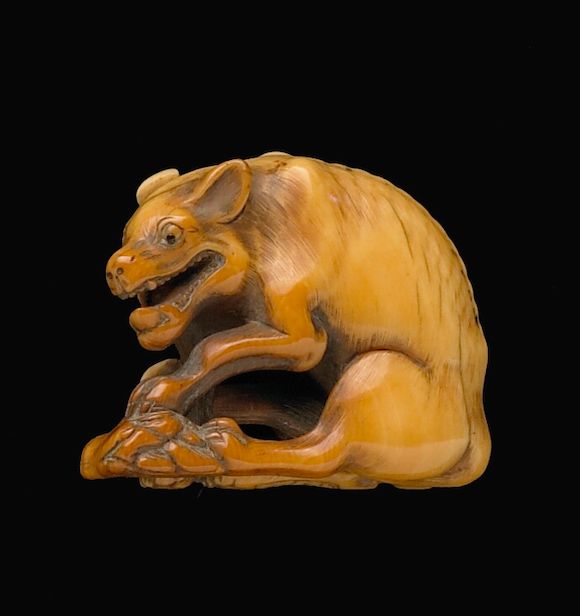 Bonhams : An ivory netsuke of a wild dog (yama-inu), School of Tomotada ...