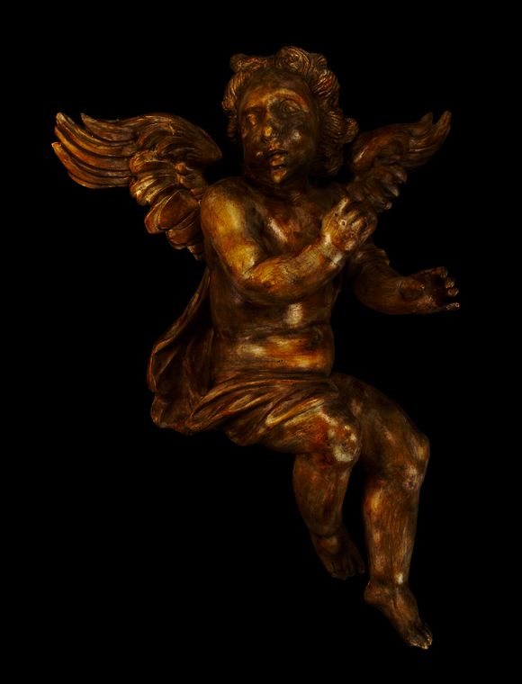 Bonhams : A Continental painted and carved figure of a putto