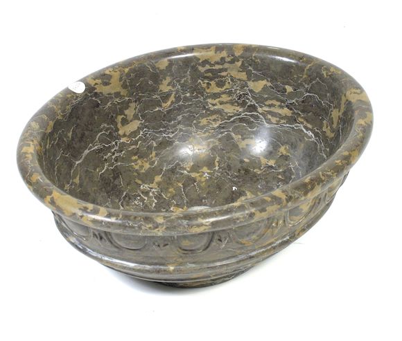 Bonhams : A carved marble basin