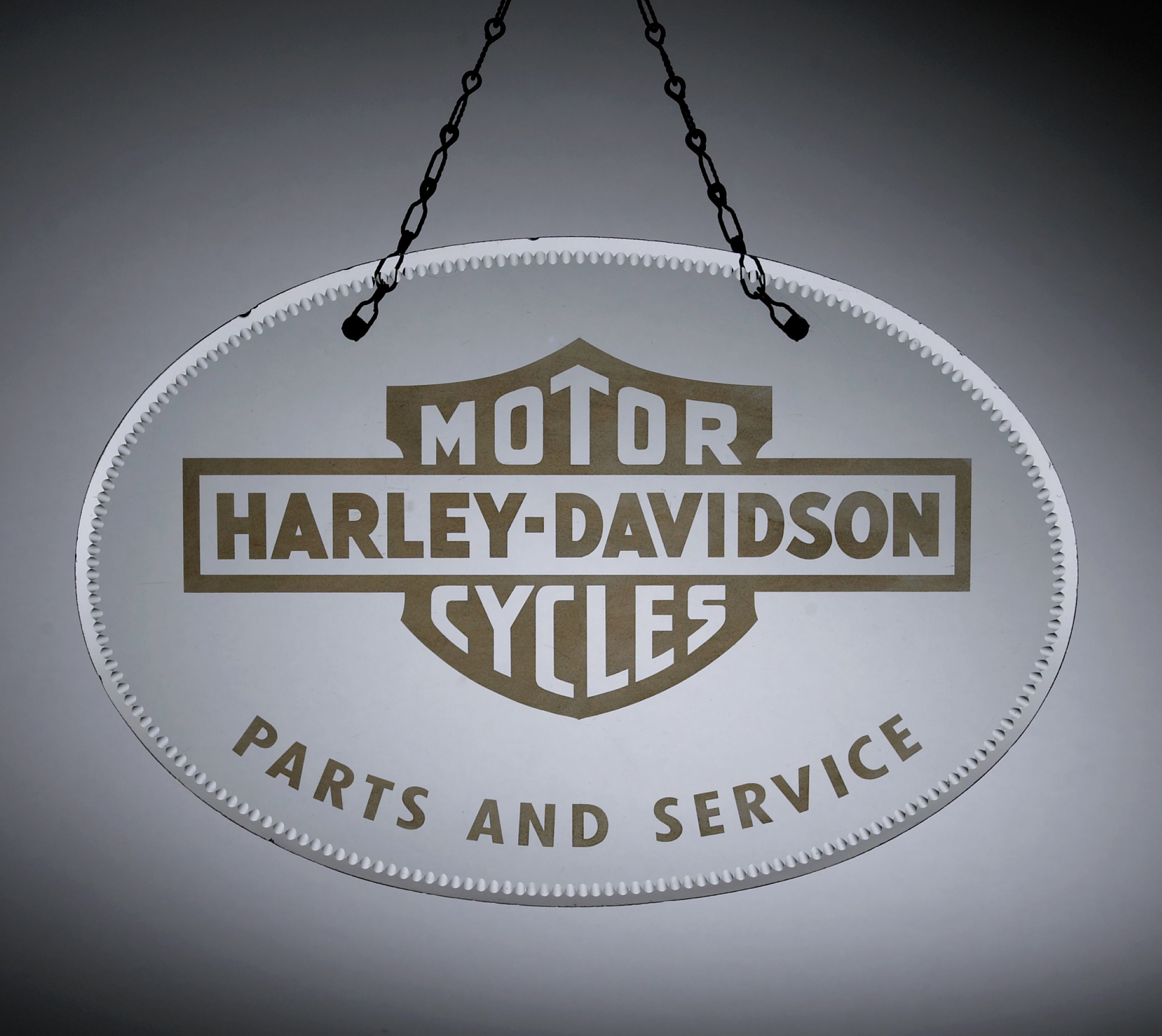 Bonhams Cars : A Harley-Davidson Parts and Service glass showroom sign,