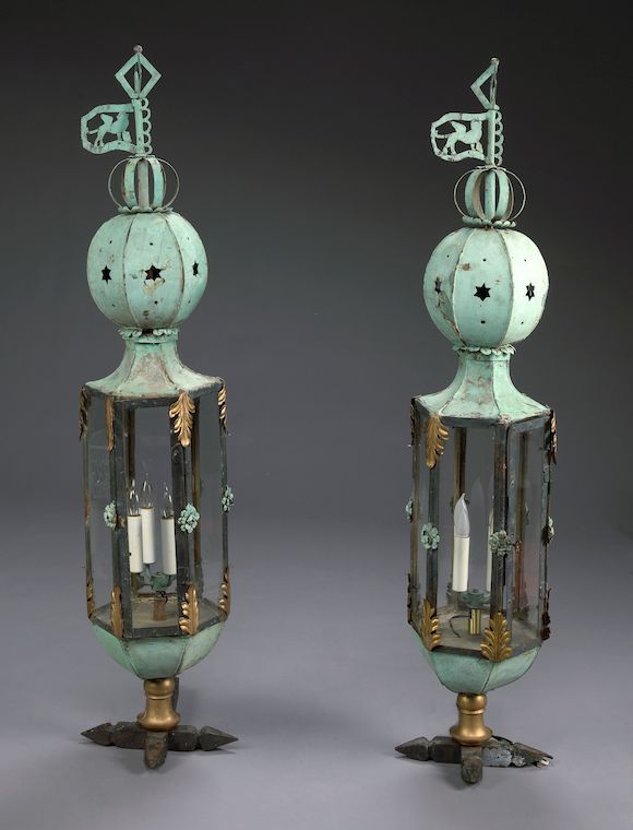Bonhams : A pair of Renaissance style wrought metal and glass wall lanterns