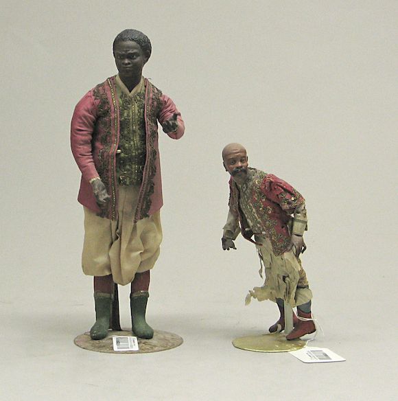 Bonhams : Two Italian polychrome composition and fabric crèche figures