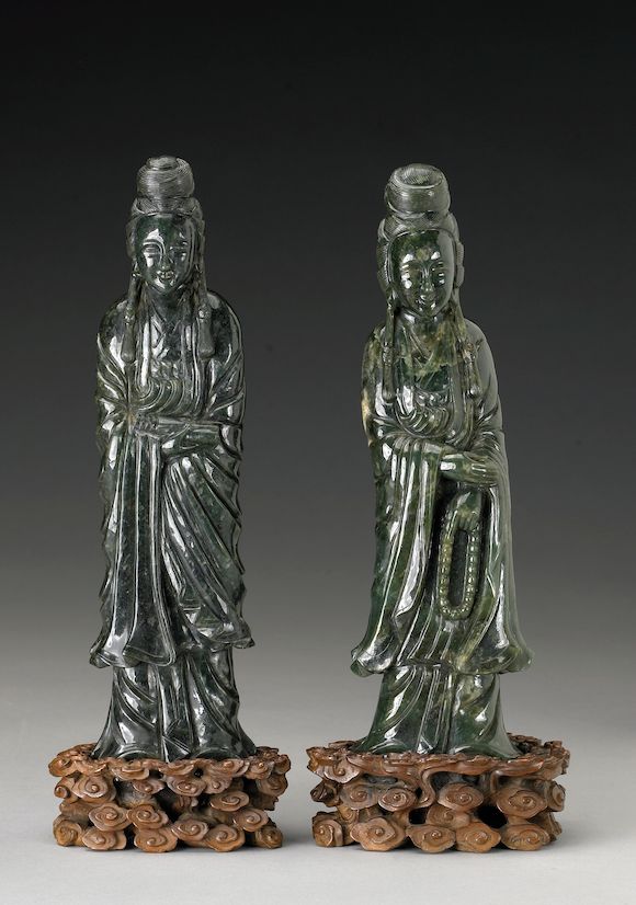 Bonhams : Two 'spinach' jade standing figures of Guanyin 20th Century