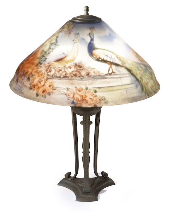 Bonhams : A Pairpoint reversed-painted glass and gilt-metal Peacock lamp