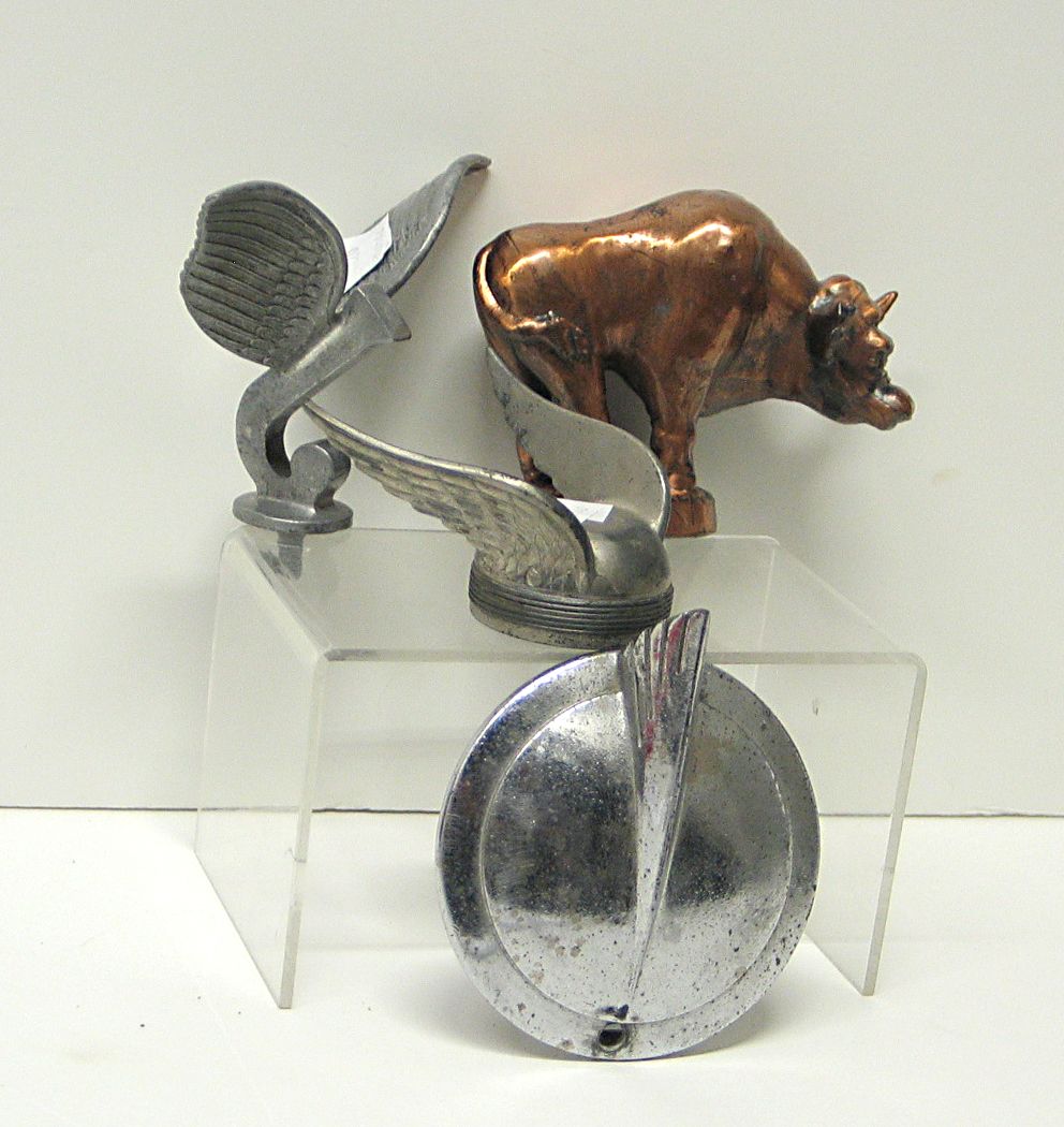 Bonhams Cars : Four motor mascots and radiator caps,