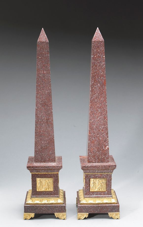 Bonhams : A pair of Empire style red granite gilt bronze mounted obelisks