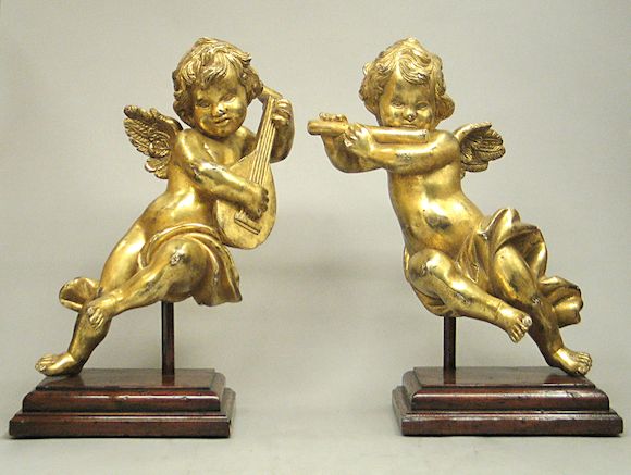 Bonhams : A pair of Baroque style giltwood figures of putti playing ...