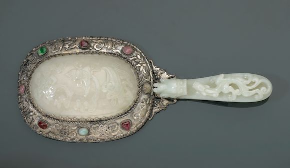 Bonhams : A silvered metal hand mirror with jade mounts