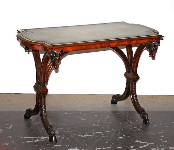 Bonhams : A Neoclassical style leather inset walnut writing table