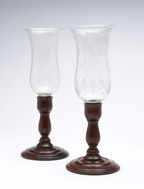 Bonhams : An assembled pair of turned wood and etched glass hurricane lamps