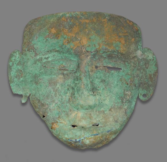 Bonhams : A Liao style gilt copper funerary mask