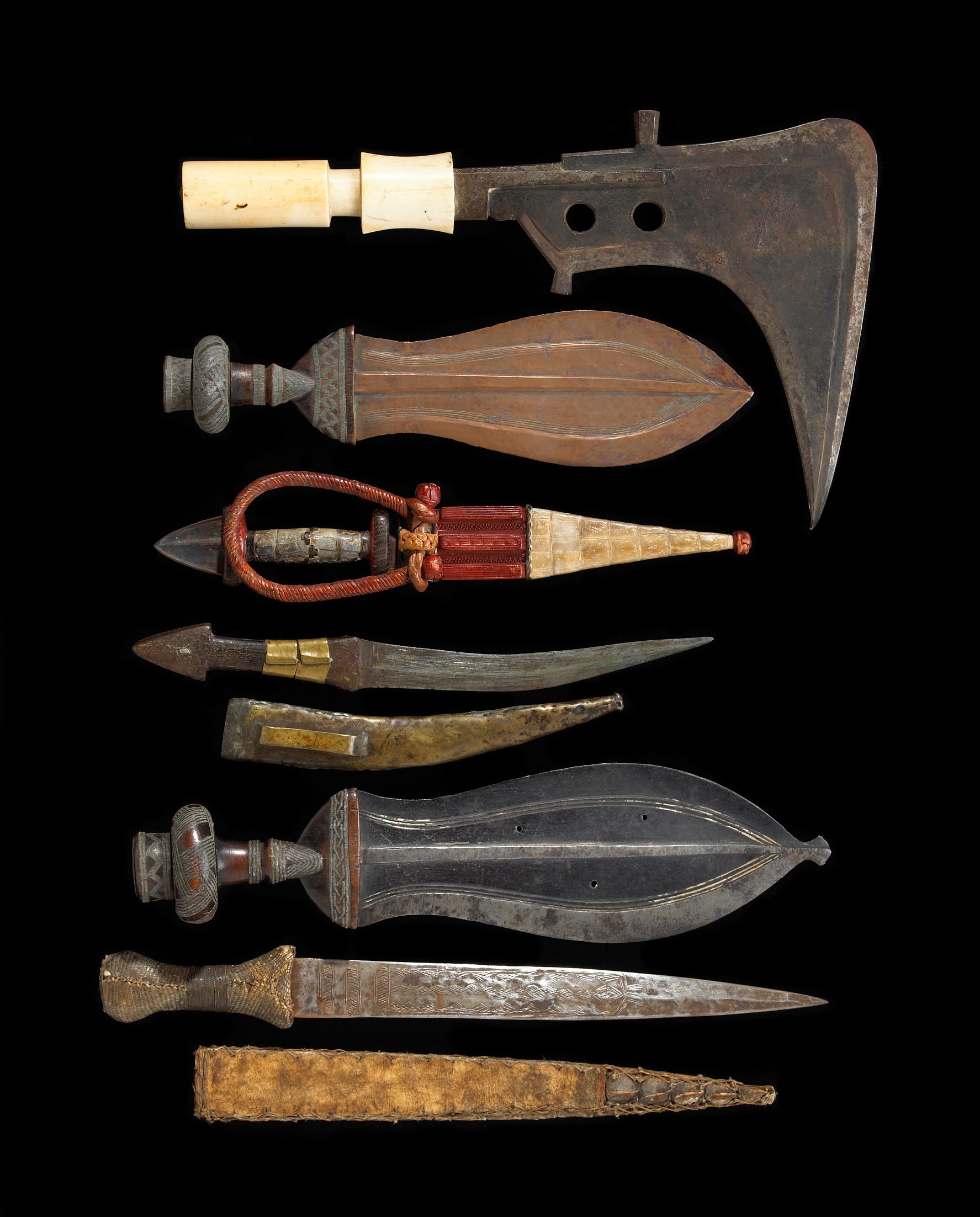 SIX AFRICAN WEAPONS: an Ashanti sword, the pierced blade with hammered ...