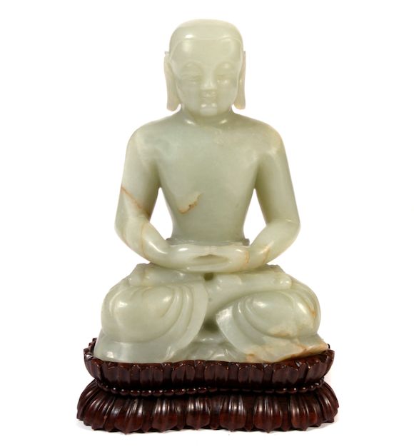 Bonhams : A Chinese carved nephrite figure of a seated Buddha