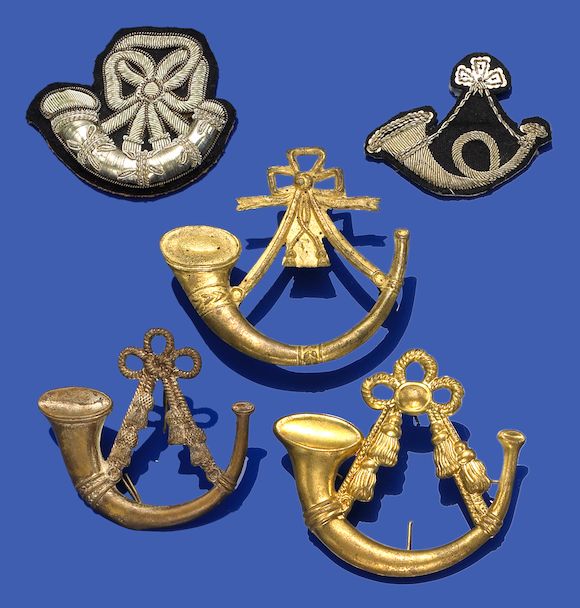 Bonhams : A group of five early Infantry hunting horn insignia