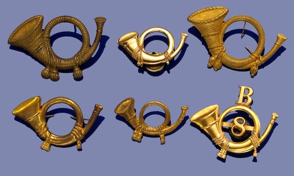 Bonhams : A lot of six Infantry hunting horn insignia
