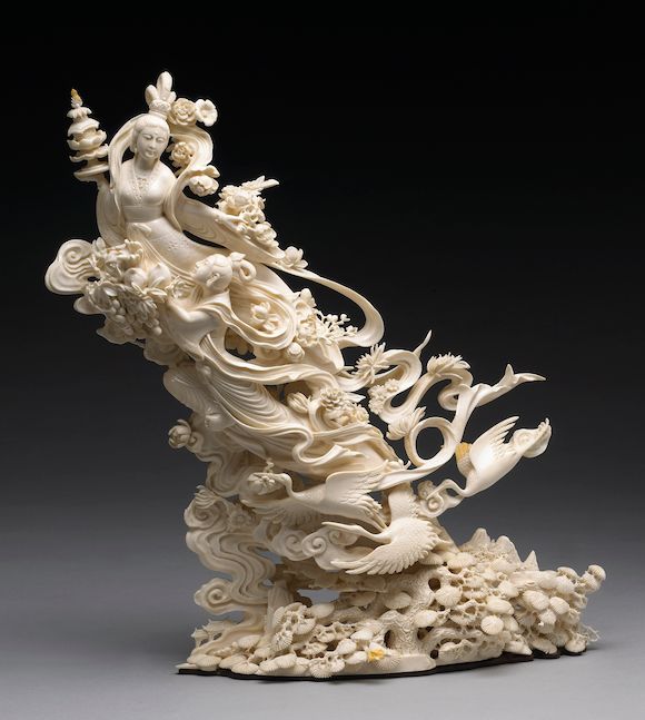Bonhams : An ivory carving of a female immortal and attendant 20th Century