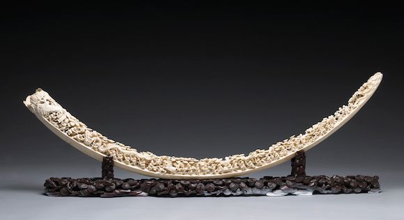 Bonhams : An ivory tusk carved with boys 20th Century