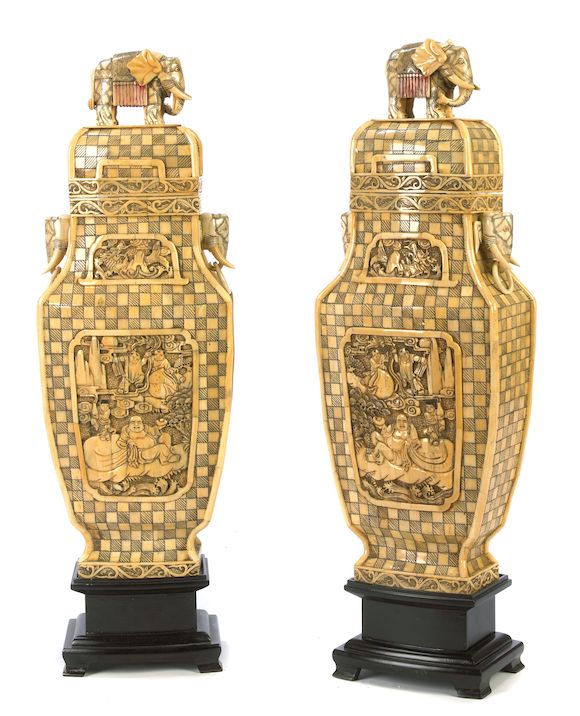 Bonhams : A pair of carved bone veneer vases with figural elephant finials