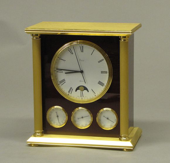 Bonhams : A Swiss enameled brass desk clock with perpetual calendar